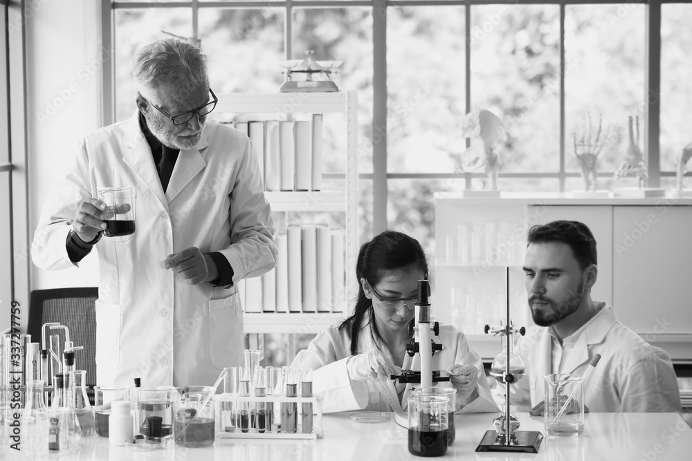 Scientists are working in science labs,scientist looking through a microscope in a laboratory ...