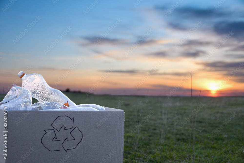Young volunteers cleaning area in park,with keep plastic bottle at ...