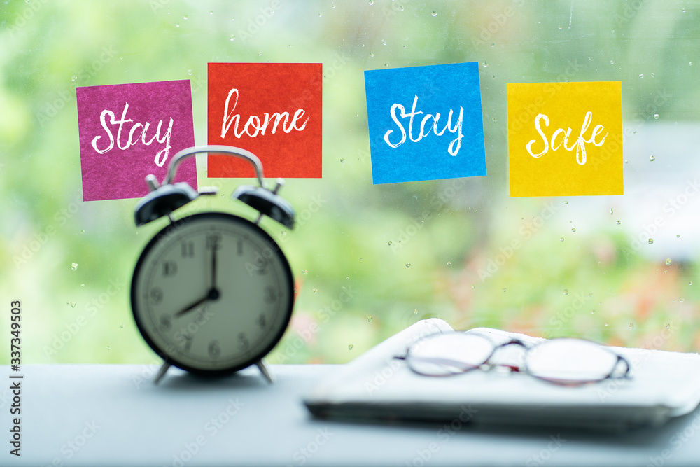 Colorful post it with Stay home stay safe word stick on windows with ...