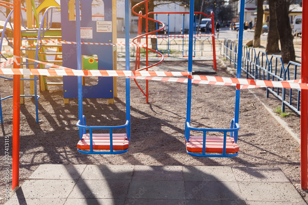 Children's playground closed and wrapped in alarm caution tape for ...