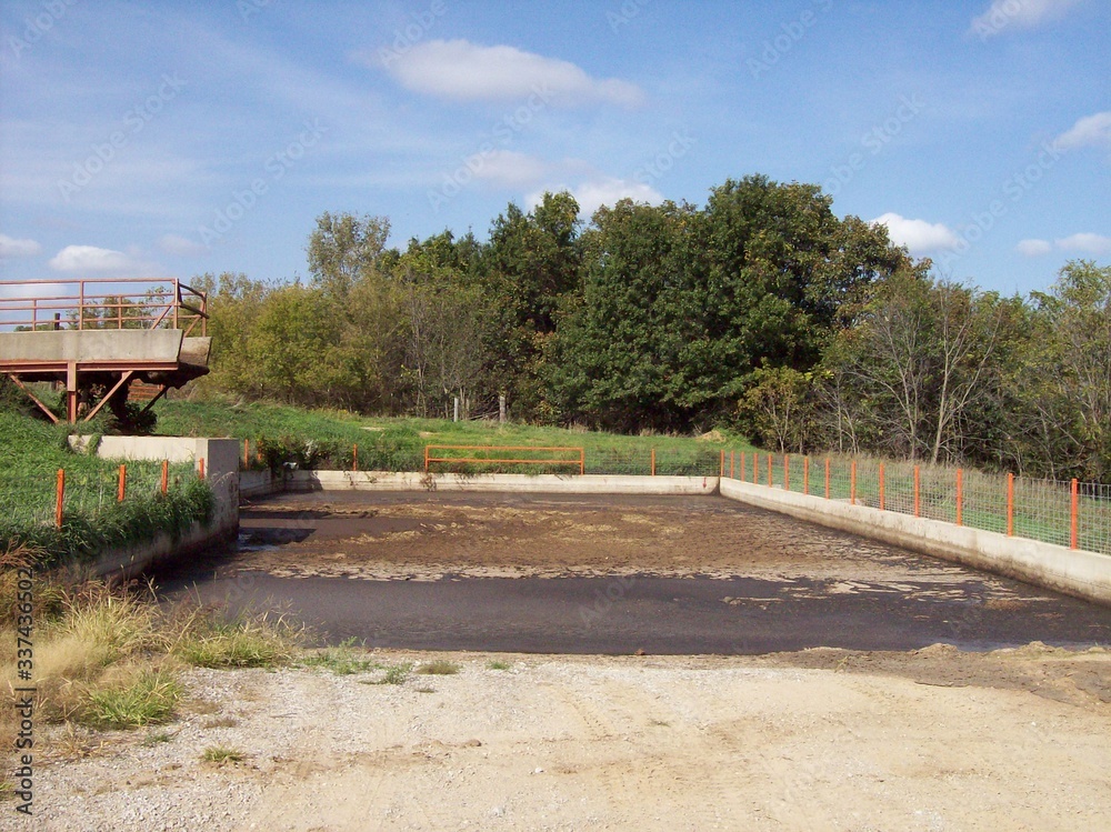 Dairy Farm concrete Manure Pit with elevated push off rail Stock Photo ...
