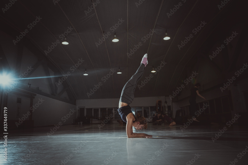 Supported Headstand Yoga Pose. Young yogi woman doing yoga headstand ...