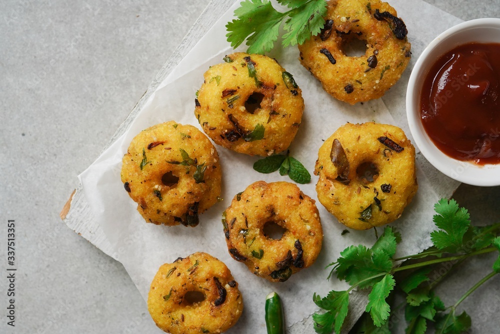 Vada/ Vadai - Tea time spicy snack with leftover rice Stock Photo ...