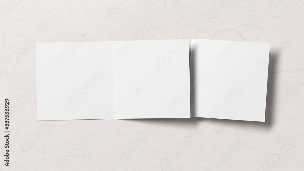 Blank square pages leaflet on white wooden background. Bi-fold or half ...