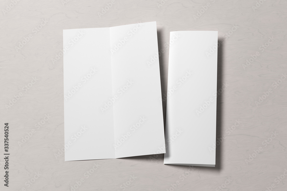 Blank vertical A4 leaflet on white wooden background. Bi-fold or half ...