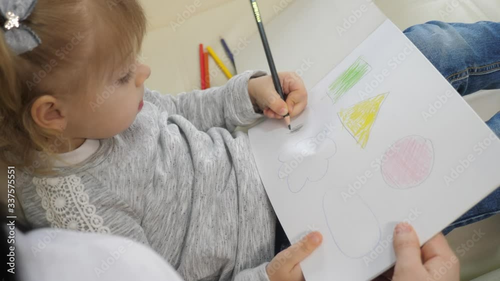 little girl and mom draw teamwork happy family concept. child daughter ...