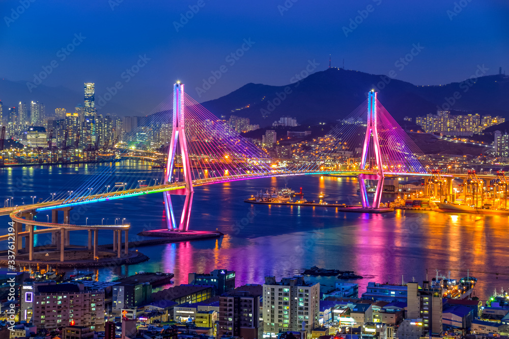 Busan harbor bridge lits up at night in different colors. Taken in ...