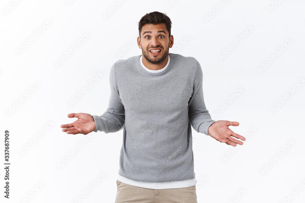 Handsome silly forgetful guy feeling sorry, apologizing late meeting ...