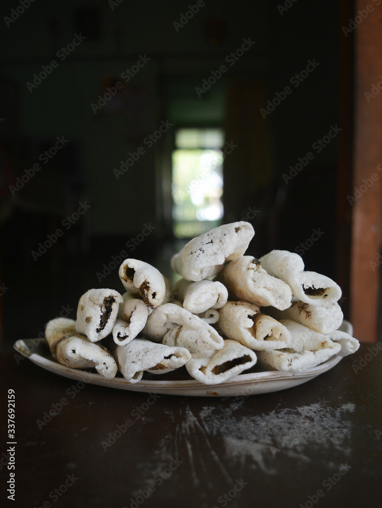 TIL PITHA, a Traditional sweet (food) of Assam. Stock Photo | Adobe Stock