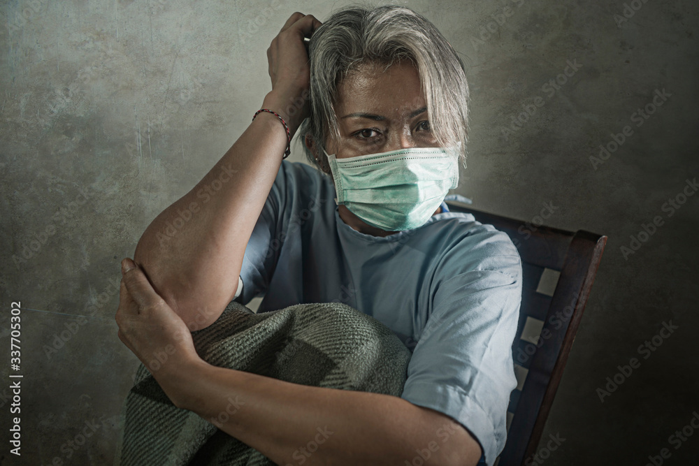 covid-19 virus spreading disease - scared and sad mature woman with ...