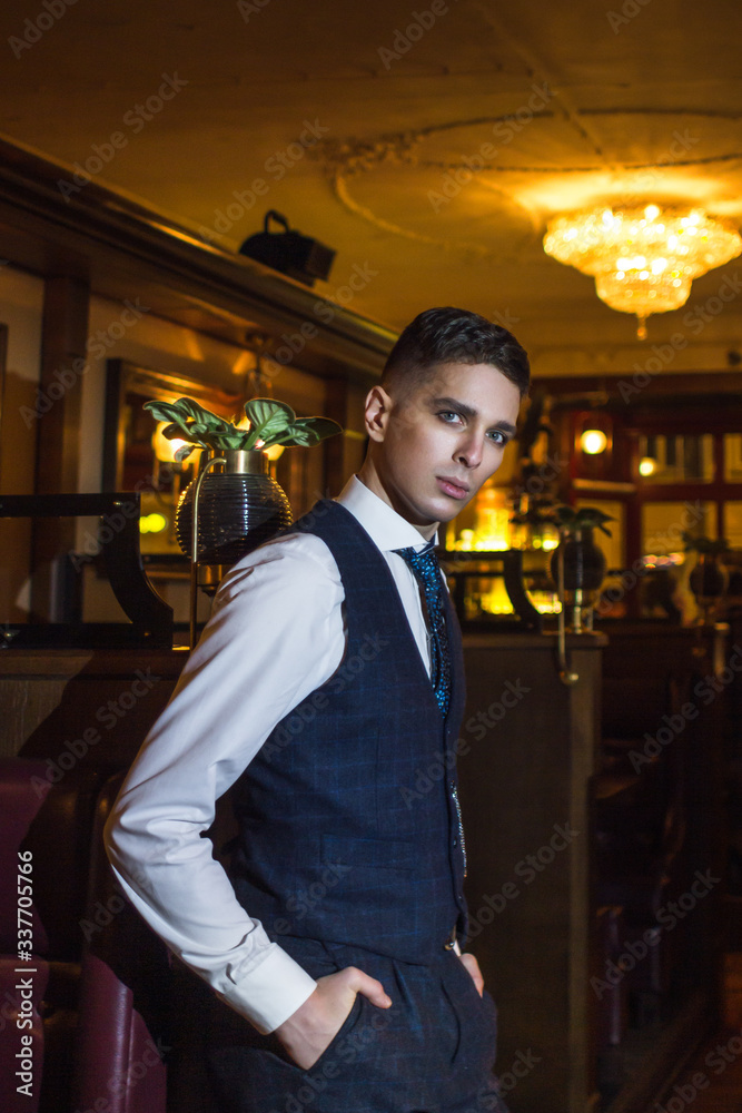 Young man in retro pub Stock Photo | Adobe Stock