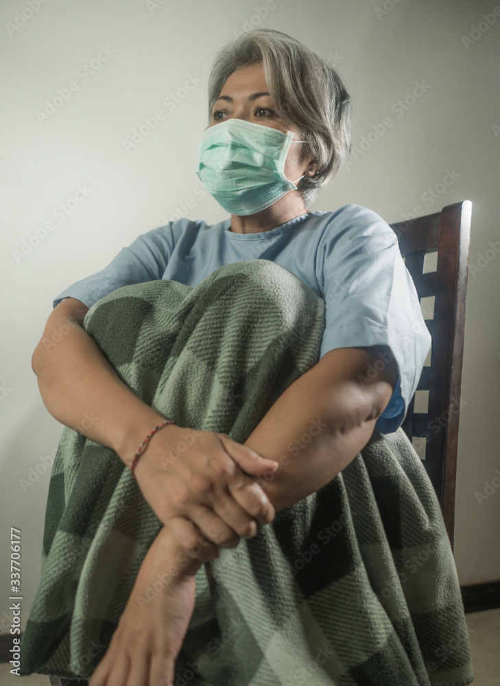 covid-19 virus spreading disease - scared and sad mature woman with ...
