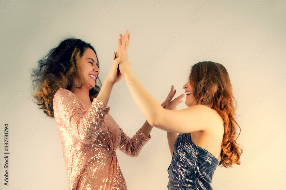 Portrait of best friends, pretty girls having fun, indoor party and ...