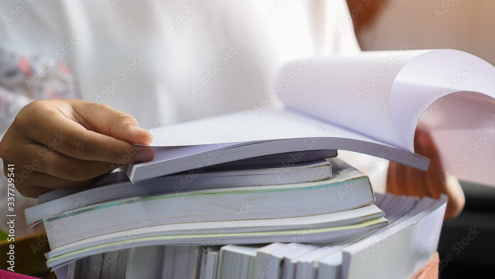 Stacks of paper files for searching information on work desk office by ...