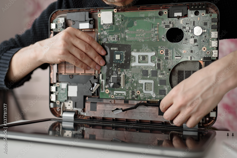 Laptop repair. Disassembled computer parts. PC electronic components ...