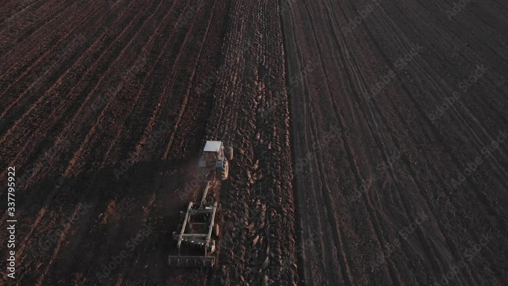 Aerial view agricultural land for planting crop. Farm Tractor with ...