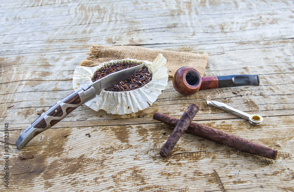 tools for the pleasure of slow smoking, pipe, cigar, tobacco and ...