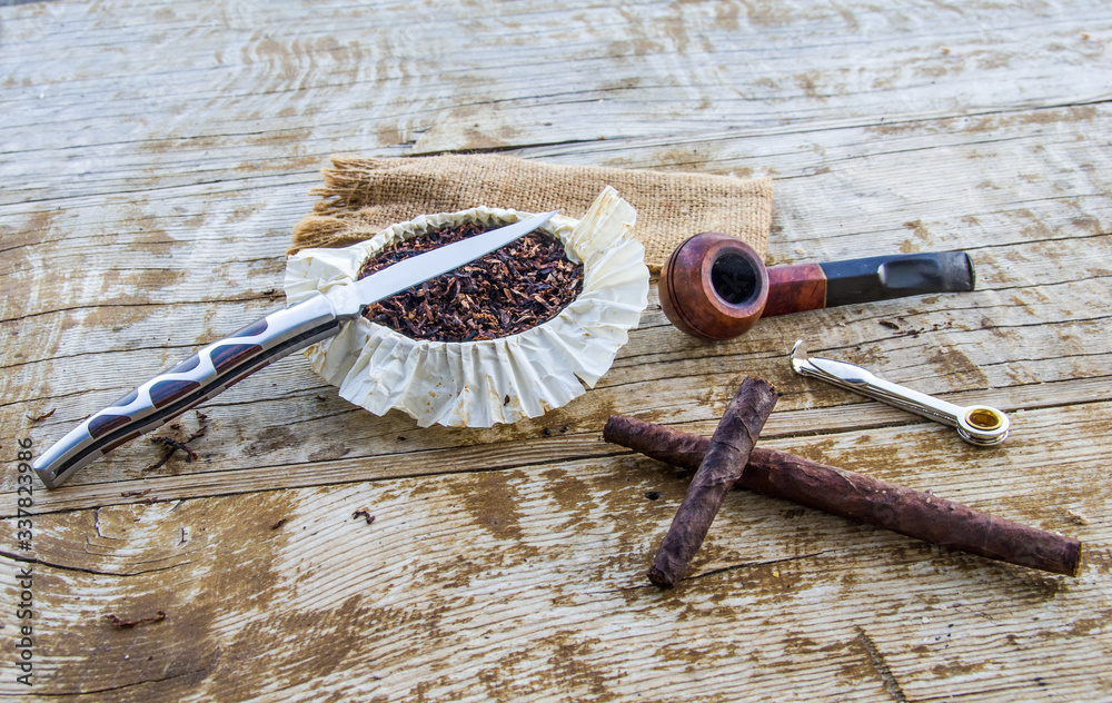 tools for the pleasure of slow smoking, pipe, cigar, tobacco and ...