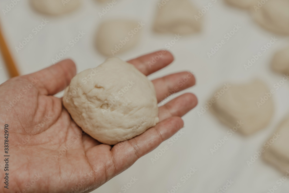 Muslim woman in isolation making bread for meal during holy month ...