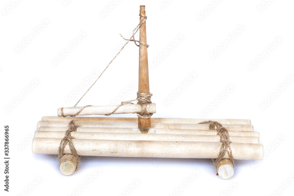 Toy wooden raft made of natural logs and ropes with a mast. Isolated on ...