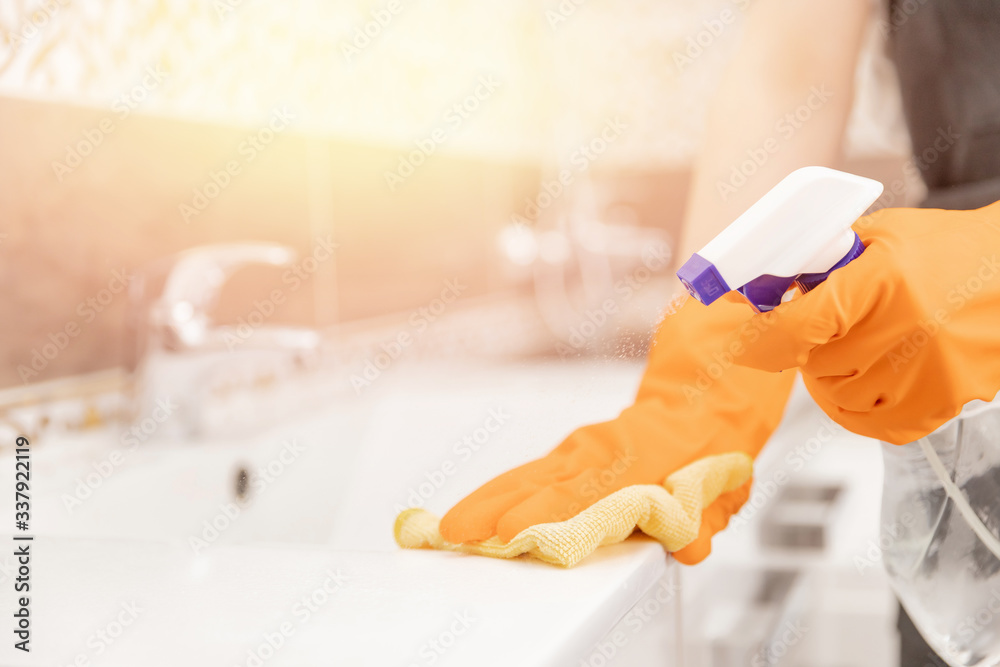 Cleaning tap from limescale in bathroom, disinfecting surface from ...