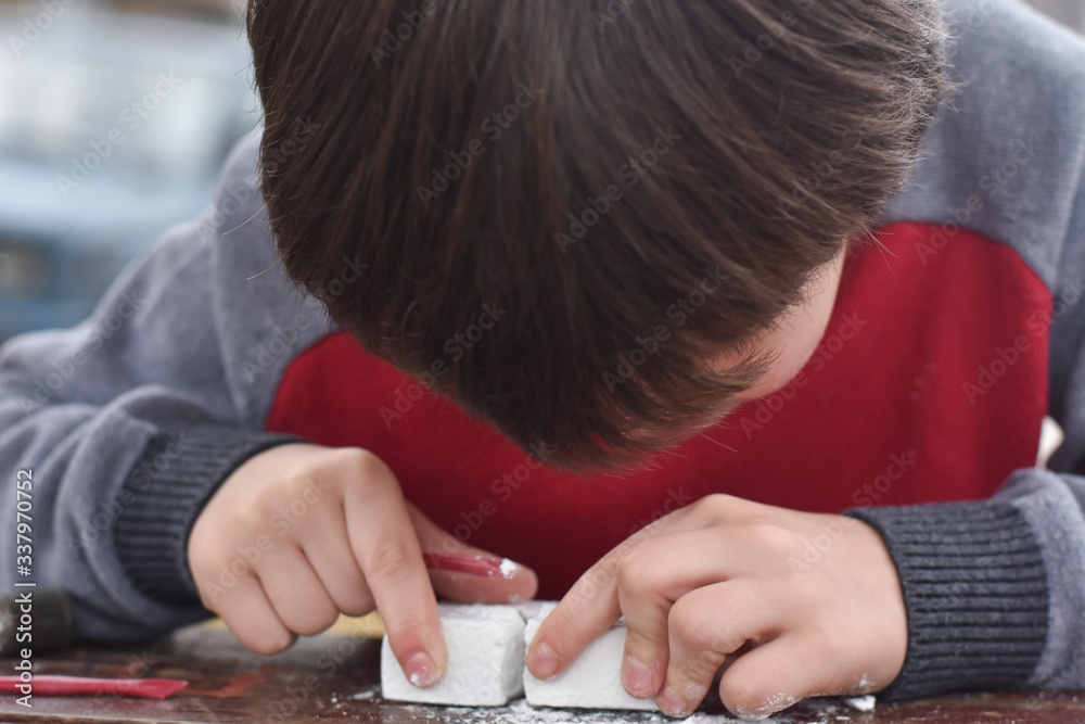 Children having fun with archaeology excavation kit. Boy plays an ...