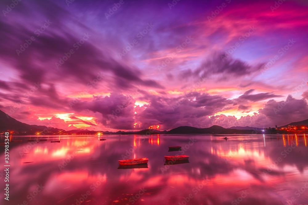 Beautiful pink sky with its reflection in the lake Stock Photo | Adobe ...