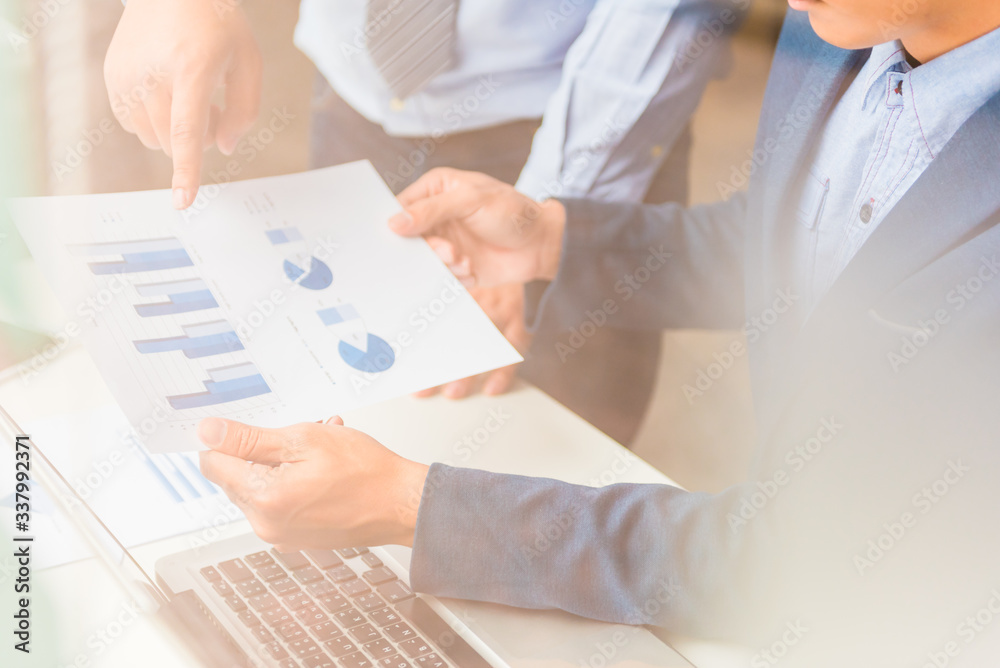 Close-up Of Business Colleagues Discussing Over Document While Working ...