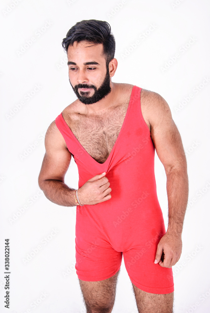 Handsome young male Asian wrestler wearing red body suit or unitard ...