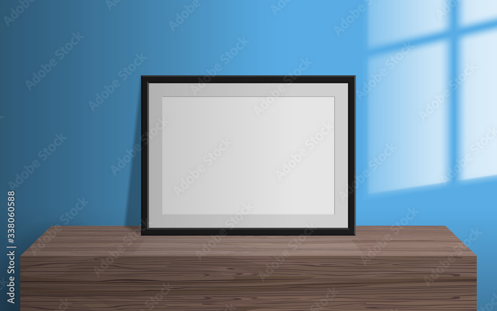 empty blank picture frame on wooden table window light effect on the ...