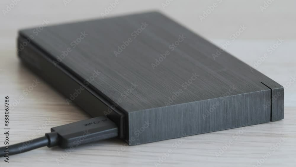 External Hard Drive On a Table, Led Light Flickering Softly - Solid ...