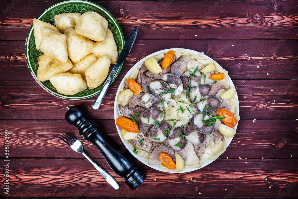 Beshbarmak dish with baursak - traditional Kazakh Asia food and ...