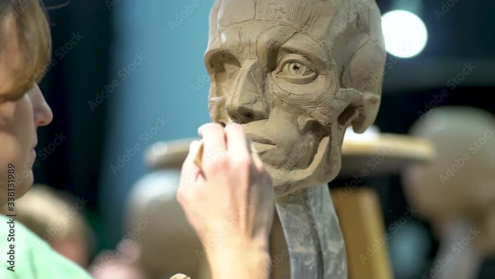 The process of creating ecorche. The sculptor is working. Sculpture of ...