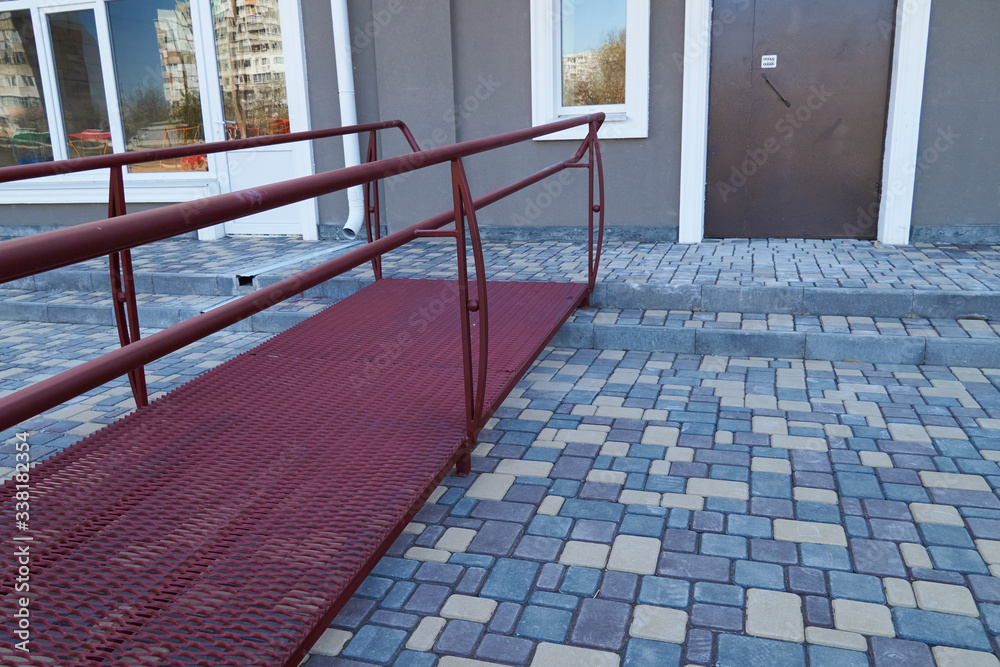 Wheelchair access ramp for entrance of residential multistory building ...