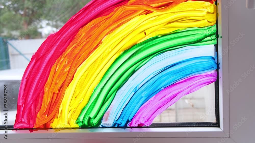 4k. large rainbow pattern on window during Covid-19 quarantine at home ...