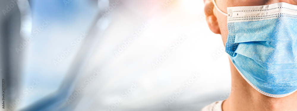 Man face mask cover nose and mouth portrait. Wide banner space for text ...