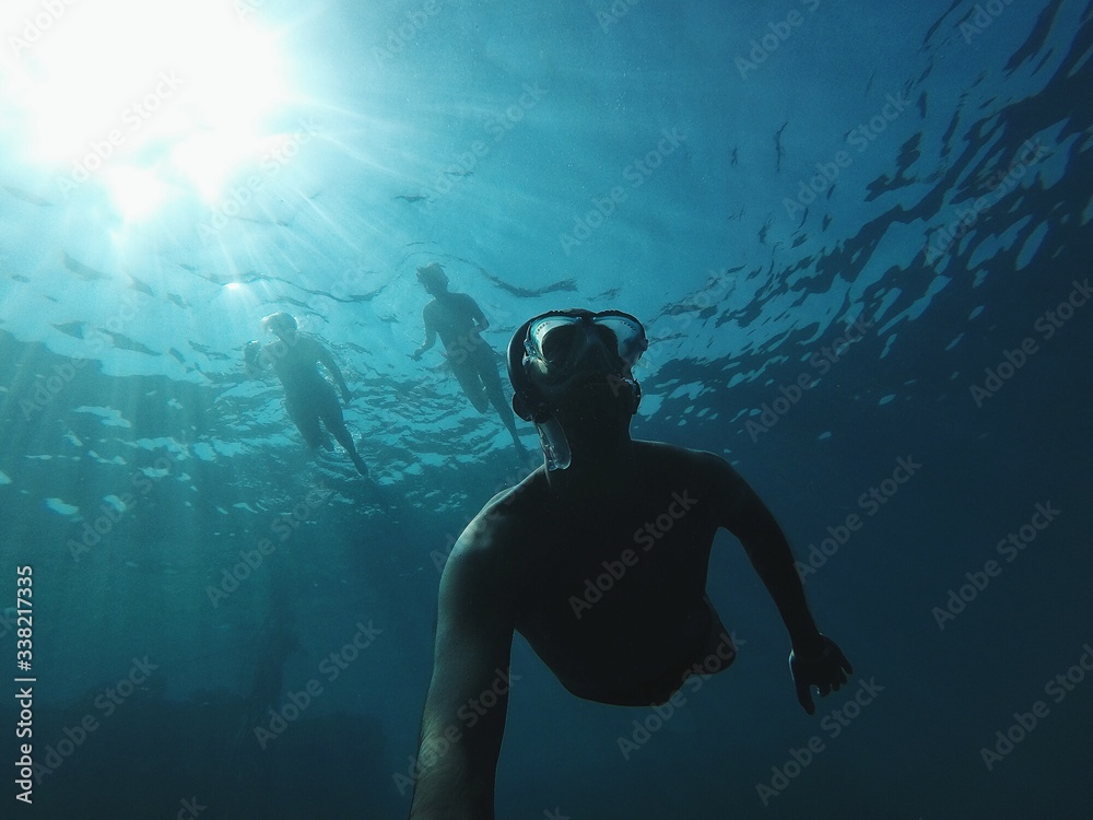 People Swimming In Sea Stock Photo | Adobe Stock
