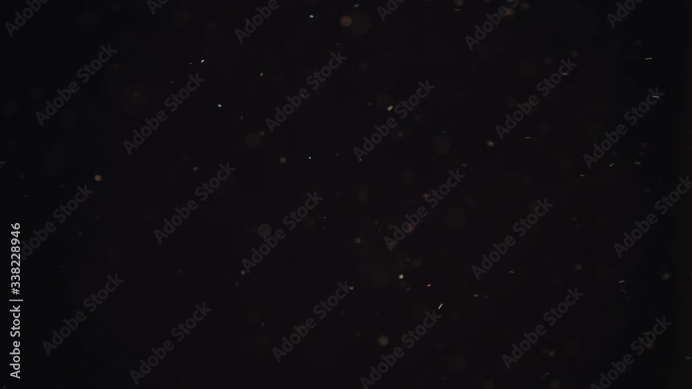 Video „4k Natural Dust Organic Floating particles on black background ...