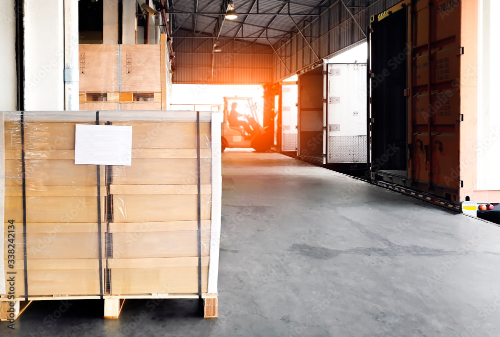Foto de Interior of distribution warehouse, stack of package boxes ...