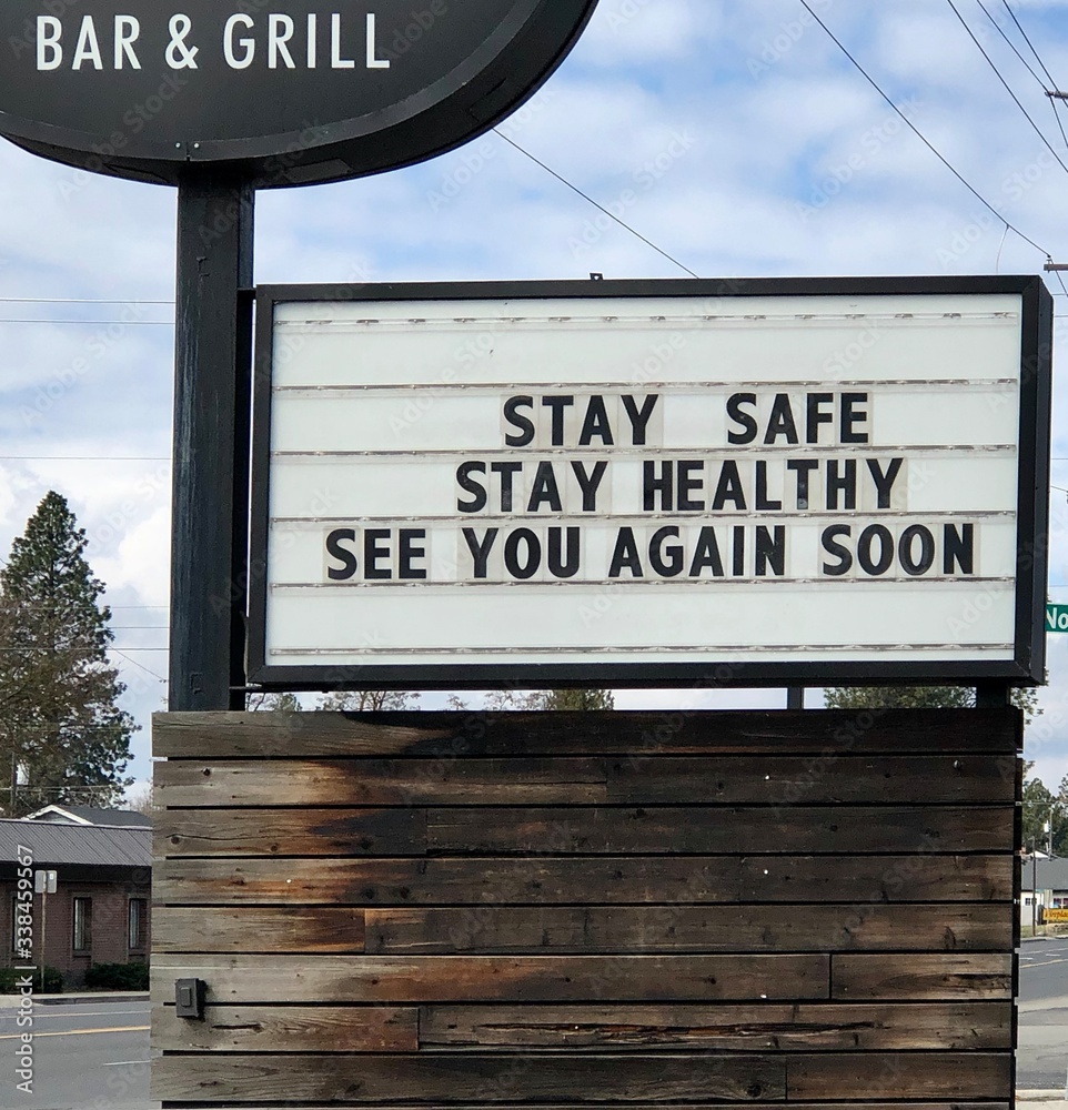 Stay safe, stay healthy - see you again soon is written on a restaurant ...