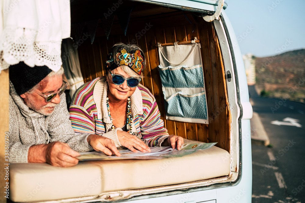 Happy old senior couple enjoy the together travel in old vehicle ...