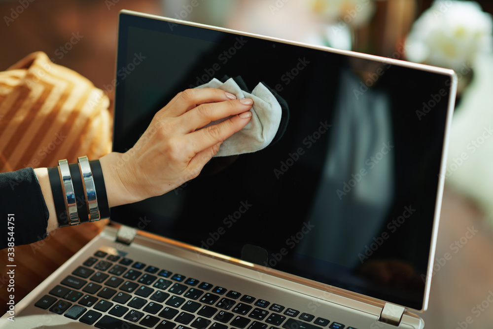 modern woman wiping laptop display with cleaning cloth Stock Photo ...