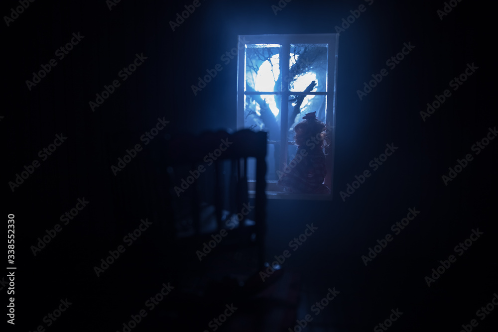 Old creepy eerie baby crib near window in dark room. Scary baby ...