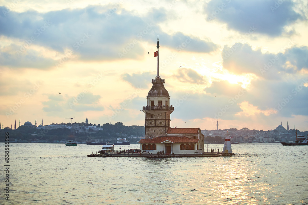 Fiery sunset over Bosphorus with famous Maiden's Tower (Kiz Kulesi in ...