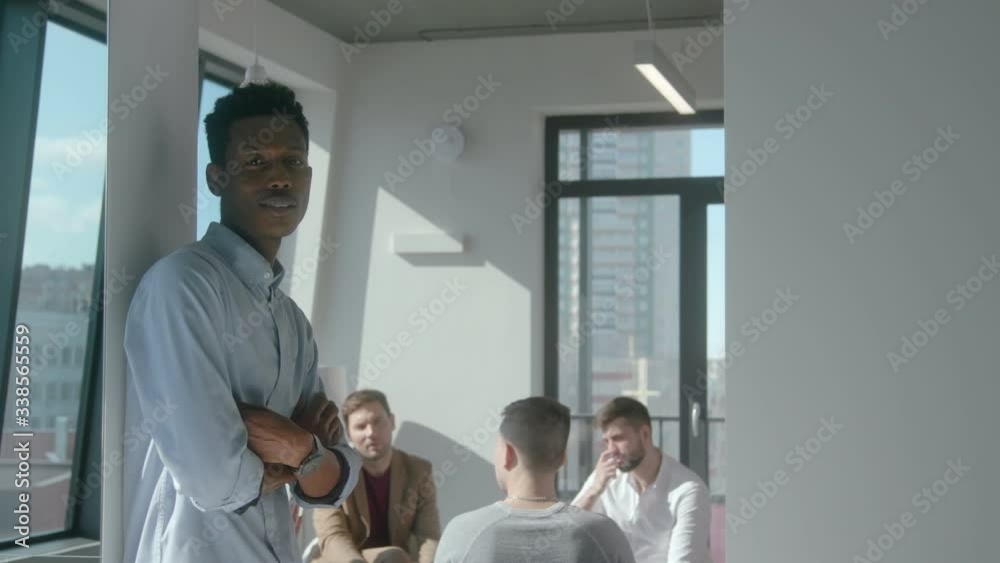 Positive and cheerful african american young successful programmer ...