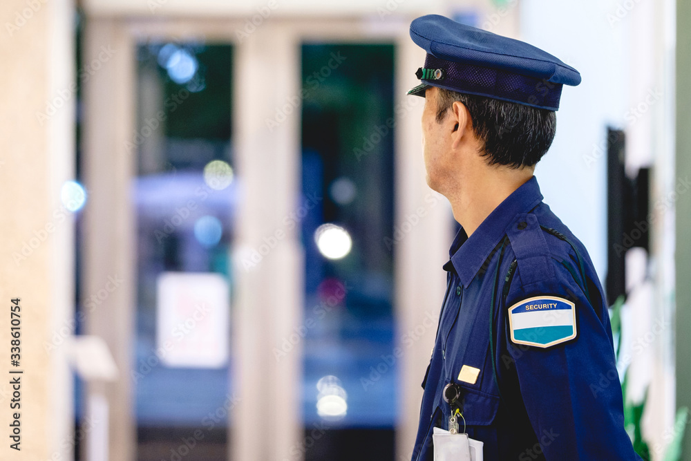 Japanese security guard from back at Tokyo by night Stock Photo | Adobe ...