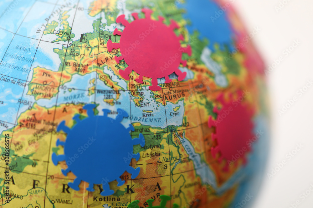 Close-up of globe and microbes on it. Virus and infection all over ...