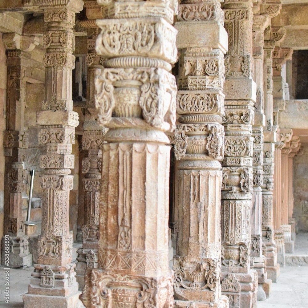 Inside the Qutub Minar Complex with antic ruins and inner square ...