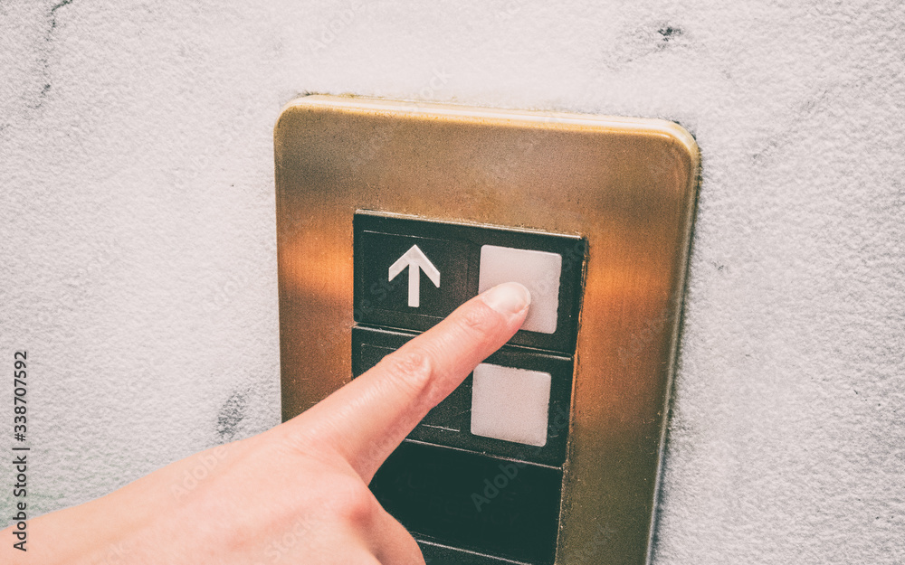 COVID-19 hygiene prevention. Pressing elevator button with finger ...