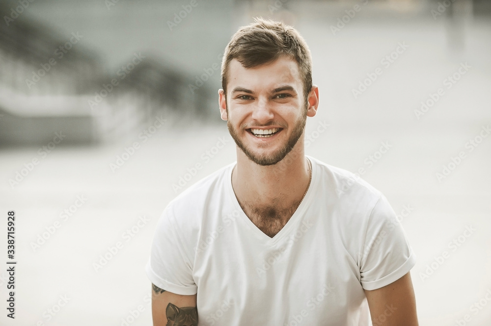 smiling friendly guy with a variety of emotions; a man in a white T ...